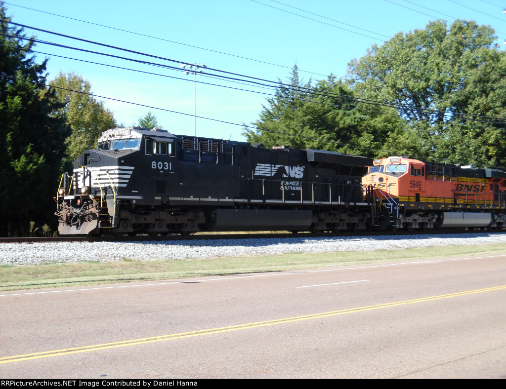 A NS ES44AC leads NS 734